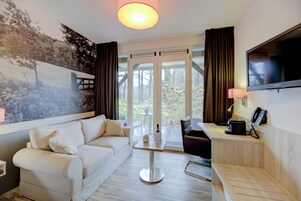 Quarto superluxo, vista para o jardim | Roupas de cama premium, cofres nos quartos, escrivaninha