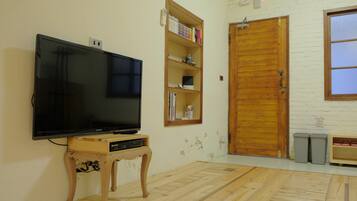 Casa Signature, 1 quarto, não fumadores, Vista para a cidade | Sala de estar | TV de ecrã plano