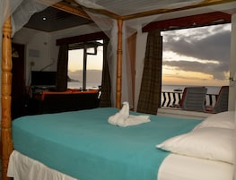 Apartamento Signature, 1 quarto, kitchenette, vista para o oceano | Ferro/tábua de engomar, camas desdobráveis, Wi-fi grátis