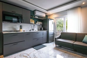 Apartamento, 1 cama King e sofá-cama, para não fumantes, cozinha | Cozinha privada