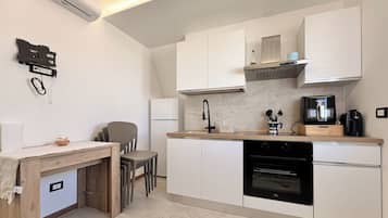 Penthouse, vista para o mar | Cozinha privada