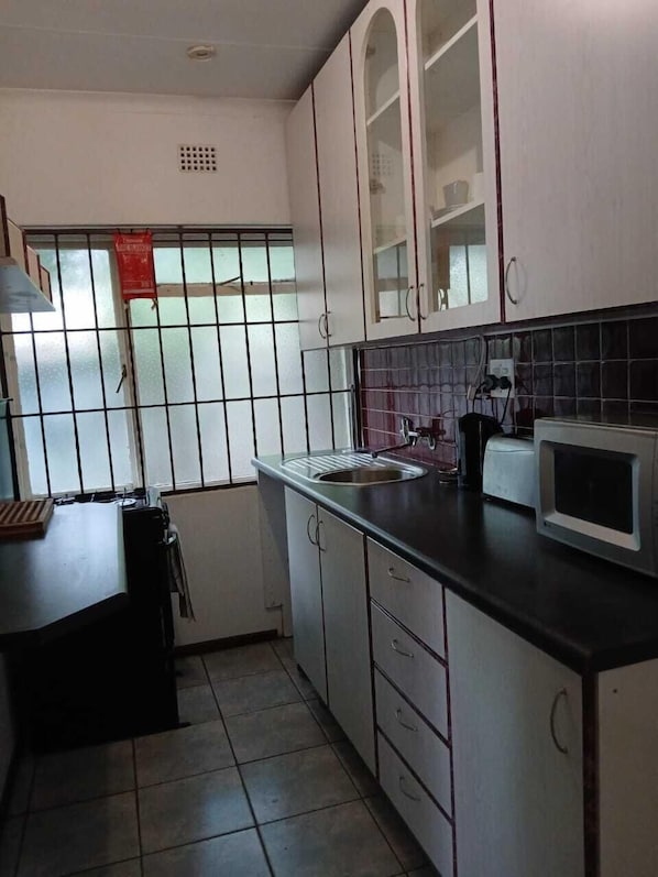 Apartamento, varanda, vista para o jardim | Cozinha privada