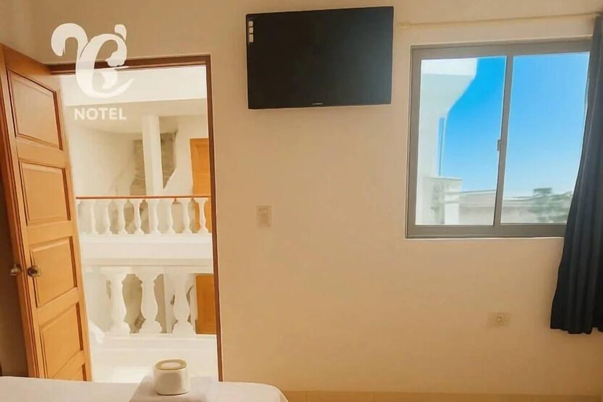 Quarto Triplo Familiar, vista parcial para o oceano | Cortinas/cortinados opacos, quartos insonorizados