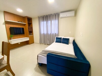 Casa com churrasqueira Ar e 2 quartos