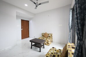 Suite Premium, varanda, vista para o jardim | Sala de estar