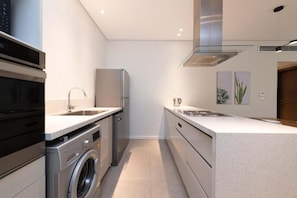 Apartamento, varanda | Cozinha privada