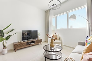 Apartamento Empresarial | Sala de estar | Smart TV de 50 polegadas com canais digitais