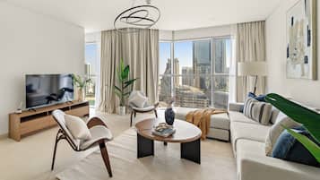 Apartamento executivo | Área de estar | Smart TV 50 polegadas com canais digitais