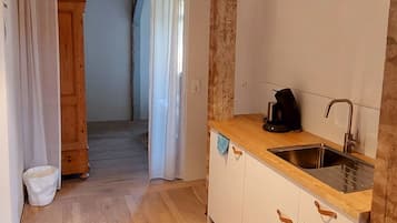 Quarto Duplo ou Twin Comfort, vista para o jardim | Cozinha privada