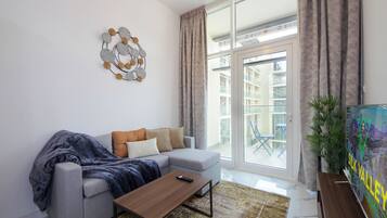 Apartamento, vista para a piscina | Sala de estar