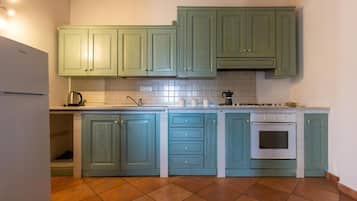 Apartamento, vista para a cidade | Cozinha privada