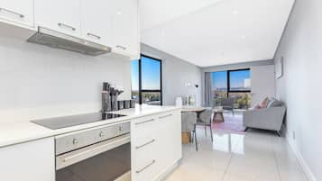 Apartamento luxo, 1 quarto | Área de estar