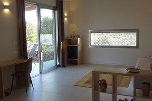 Suíte, para não fumantes, vista para o jardim | Área de estar
