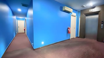 Quarto Duplo Deluxe, Vista para a cidade | Sala de estar