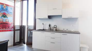 Apartamento Clássico, varanda | Cozinha privada