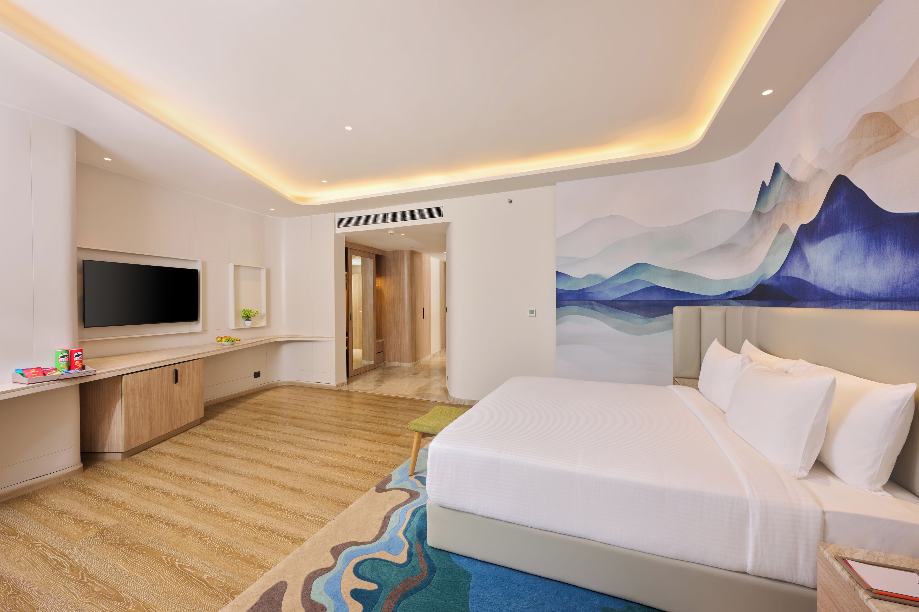 Suíte, 1 cama King | Cortinas blackout, ferros/tábuas de passar roupa, Wi-Fi de cortesia