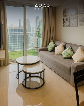 Apartamento, vista para a cidade | Área de estar