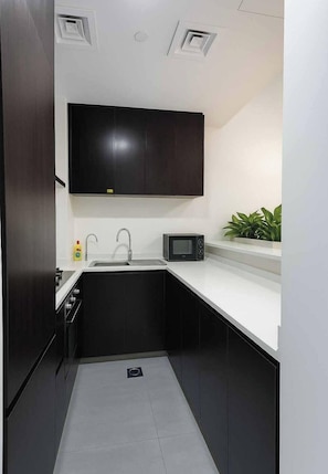 Apartamento, Vista para a cidade | Cozinha privada