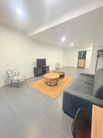 Apartamento Comfort, Vista para a cidade | Sala de estar