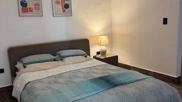 Apartamento conforto, vista para o jardim | Cortinas blackout, ferros/tábuas de passar roupa, Wi-Fi de cortesia