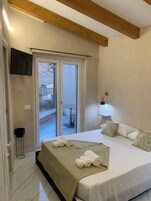Quarto Duplo, vista parcial para o mar | Terraço/pátio interior
