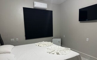 Quarto tradicional, 1 cama Queen | Wi-Fi de cortesia, roupa de cama