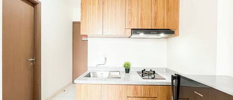 Apartamento Deluxe | Cozinha privada | Utensílios de cozinha