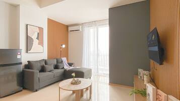 Apartamento Deluxe | Sala de estar