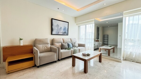 Apartamento Deluxe | Sala de estar
