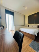 Quarto Duplo Deluxe para 1 Pessoa, 1 cama individual extragrande, Vista para a cidade | Sala de estar