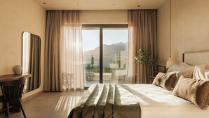 Quarto de hotel moderno com uma cama grande, uma escrivaninha e vista para montanhas pela janela.