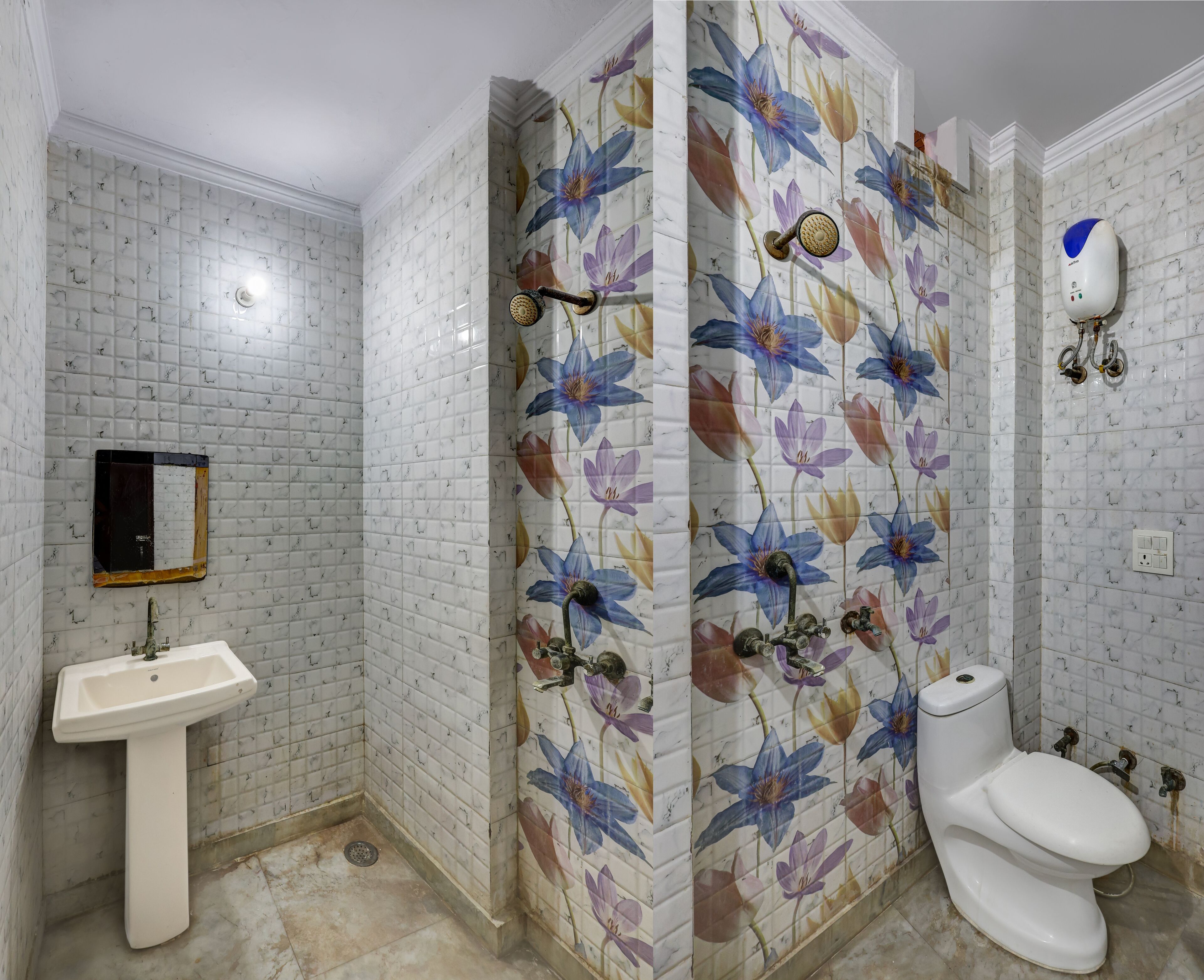 Casa de banho com lavatório, sanita e chuveiro com azulejos florais.