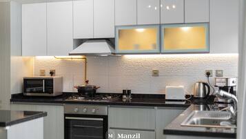 Apartamento de Luxo, varanda, Vista para a cidade | Kitchenette privada