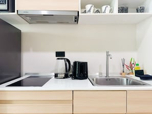 Apartamento, varanda | Cozinha privada