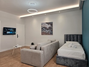 Apartamento Standard | Sala de estar | Smart TV de 40 polegadas com canais por cabo