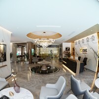 Um hall de hotel moderno com balcão de recepção, área de estar e um lustre grande.