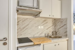 Suíte estúdio premium | Cozinha privada | Frigobar, micro-ondas, cooktop, máquina de café expresso