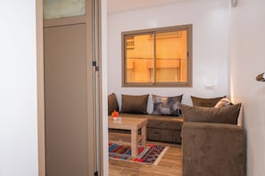 Quarto Triplo Comfort | Sala de estar