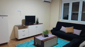 Apartamento, 1 quarto, fumadores, Vista para a cidade | Sala