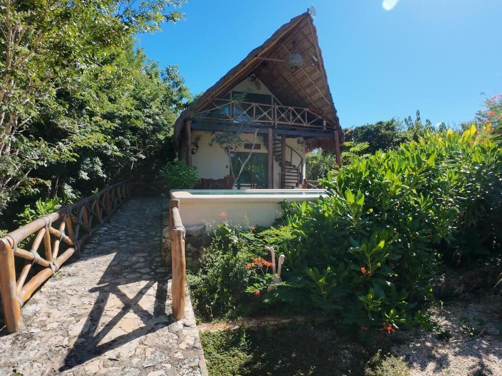 Cabana de Madeira Deluxe, vista para a piscina | Cofre no quarto, cortinas/cortinados opacos, quartos insonorizados 