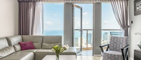 Apartamento, vista para o mar | Área de estar