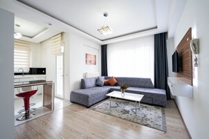 Apartamento Deluxe | Sala de estar