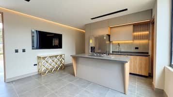 Apartamento Deluxe, vista para o jardim | Sala de estar