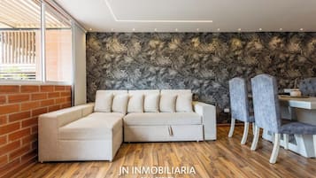 Apartamento Deluxe, vista para o jardim | Sala de estar
