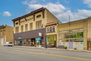 A street view with a building labeled "BPOE BLOCK" featuring a storefront with a sign for "The Great American Barbecue."