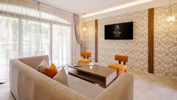 Suite Comfort, varanda, vista para o jardim | Sala de estar