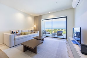 Apartamento, 1 quarto, vista para o mar | Sala de estar | Televisor LCD de 32 polegadas com canais por cabo