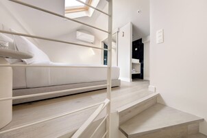 Duplex superior, 1 quarto, 2 banheiros | Roupas de cama premium, frigobar, cortinas blackout, Wi-Fi de cortesia