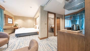 Suite Júnior | Minibar, cofre no quarto, cortinas/cortinados opacos