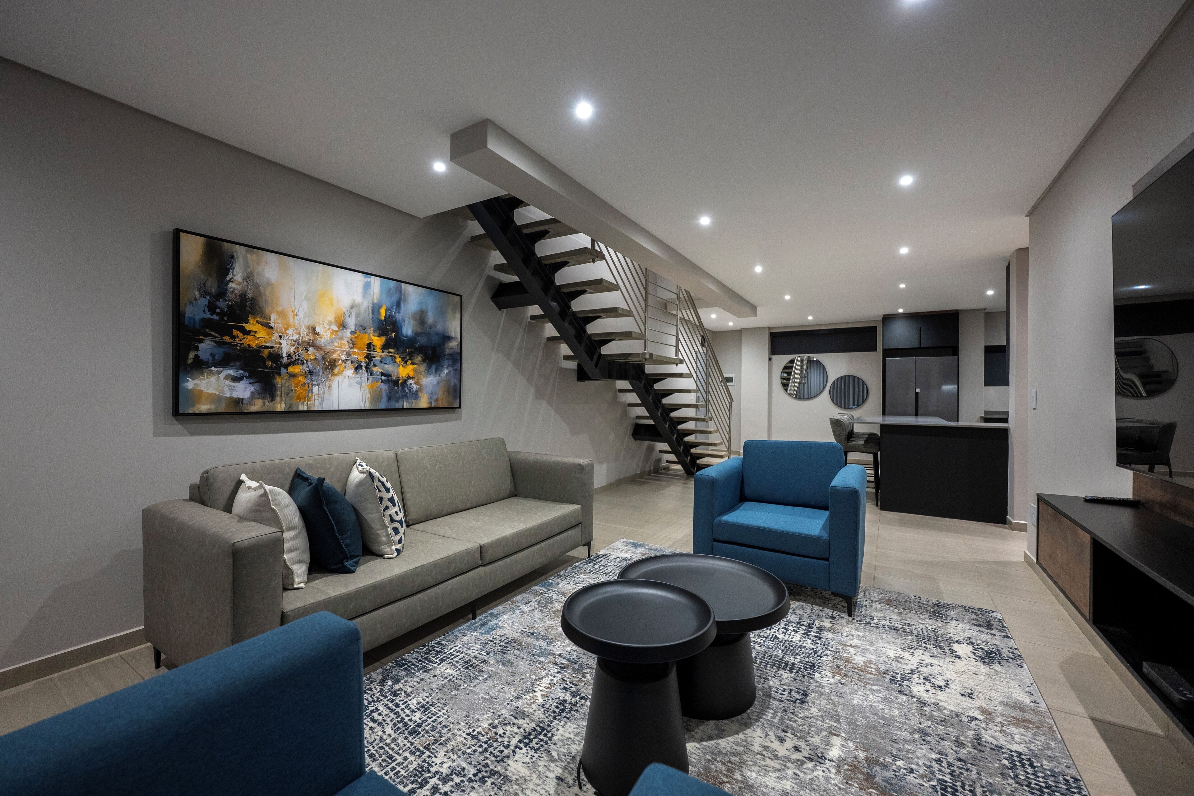 Penthouse Executiva, 4 quartos, varanda, Vista para a cidade | Sala de estar | Televisor 